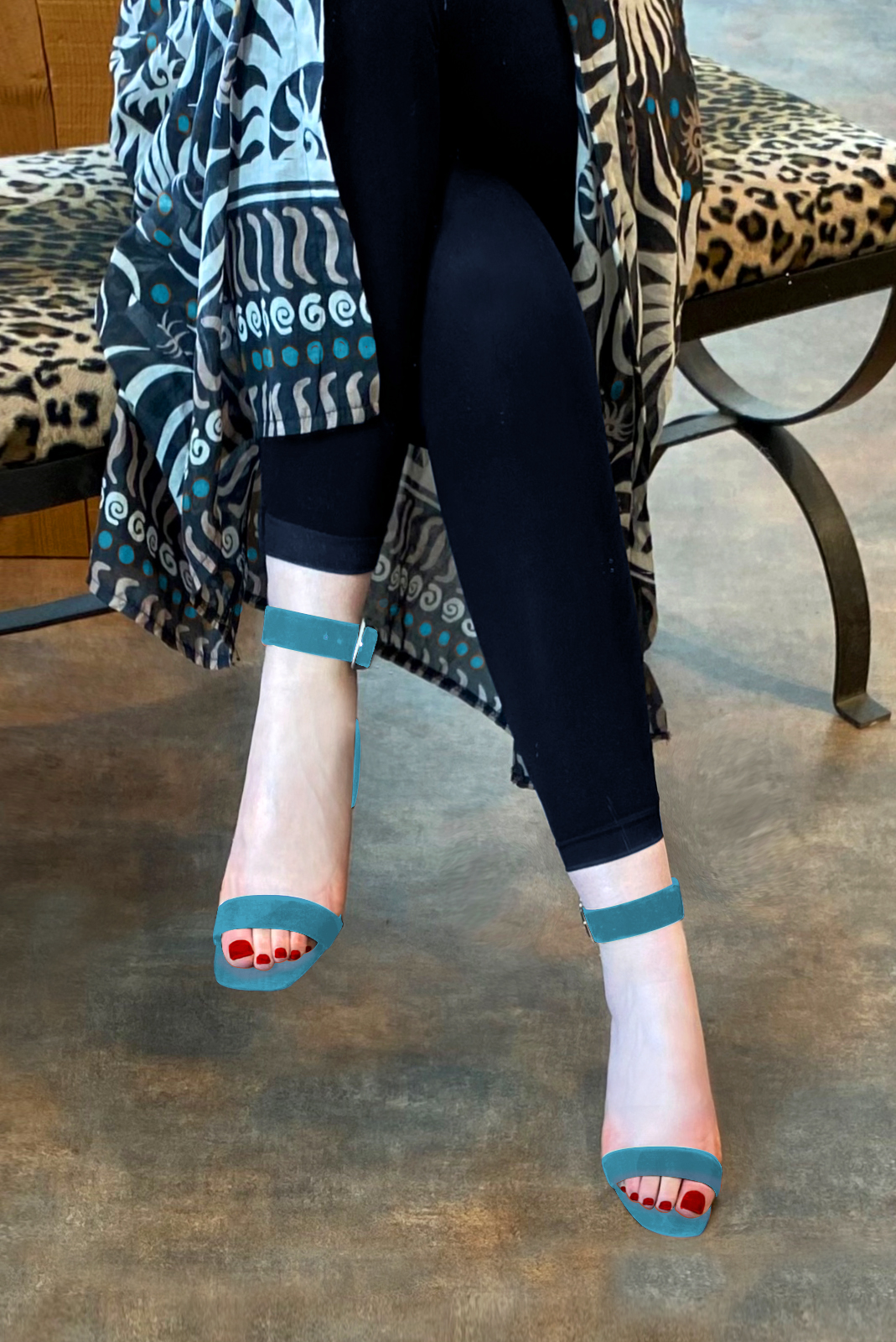 Peacock blue closed back sandals, with a strap around the ankle. Square ...