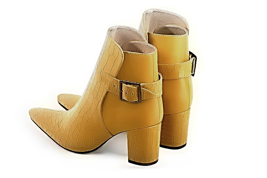Mustard yellow ankle boots with buckles at the back. Tapered toe ...