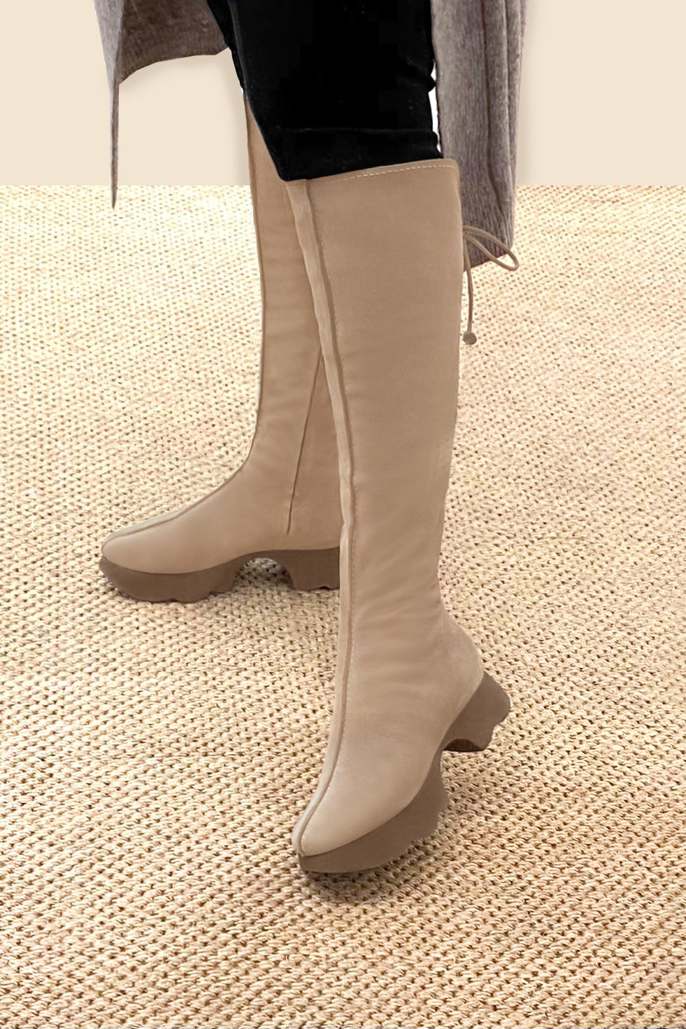 Biscuit beige knee-high boots, with laces at the back. Round toe. Low ...